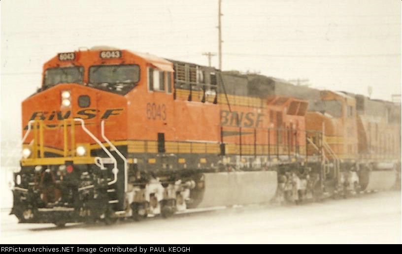 bnsf 6043 blows up the snow as she rolls into Lincoln.